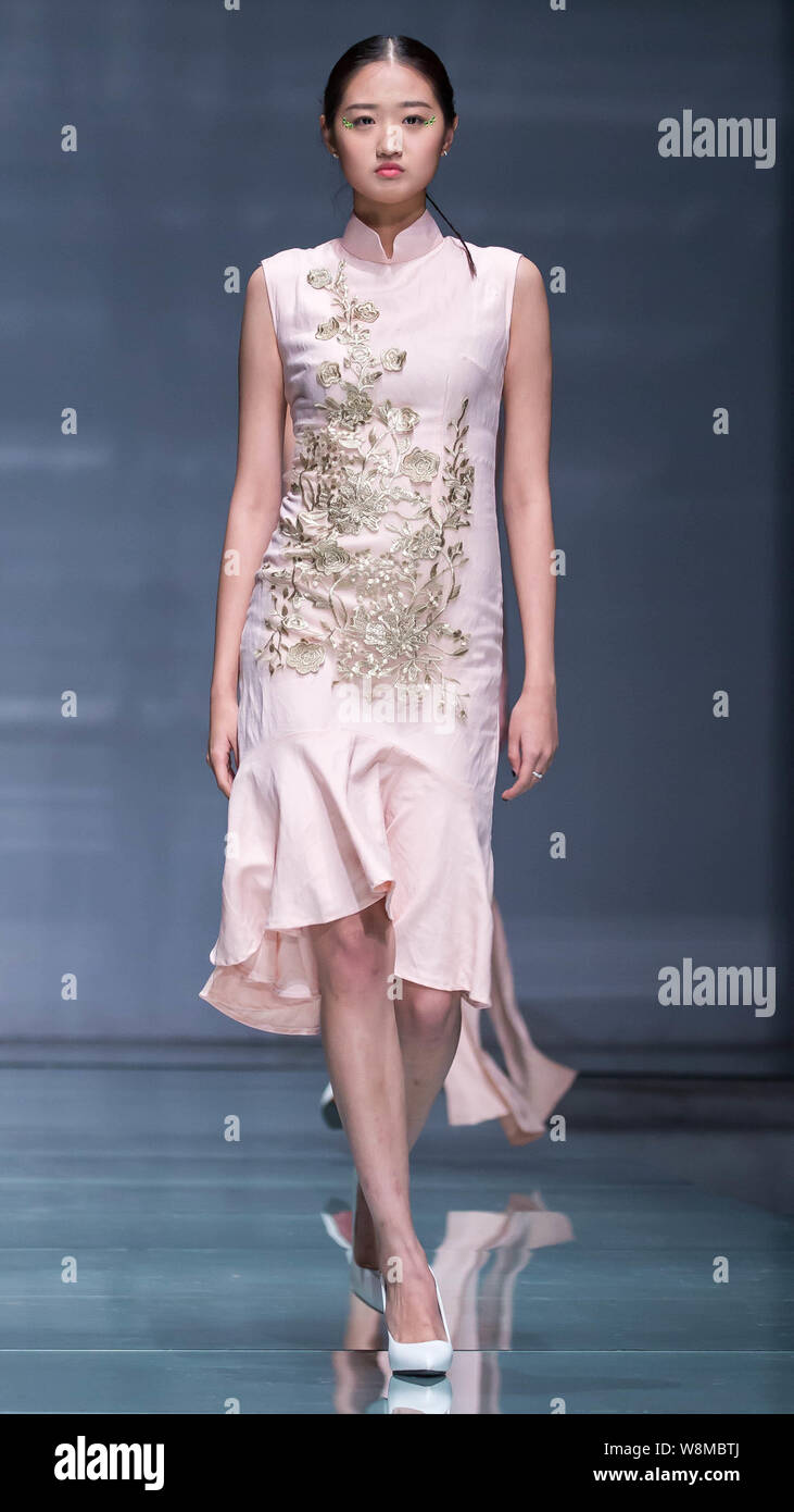 A model displays a creation designed by a student from School of ...