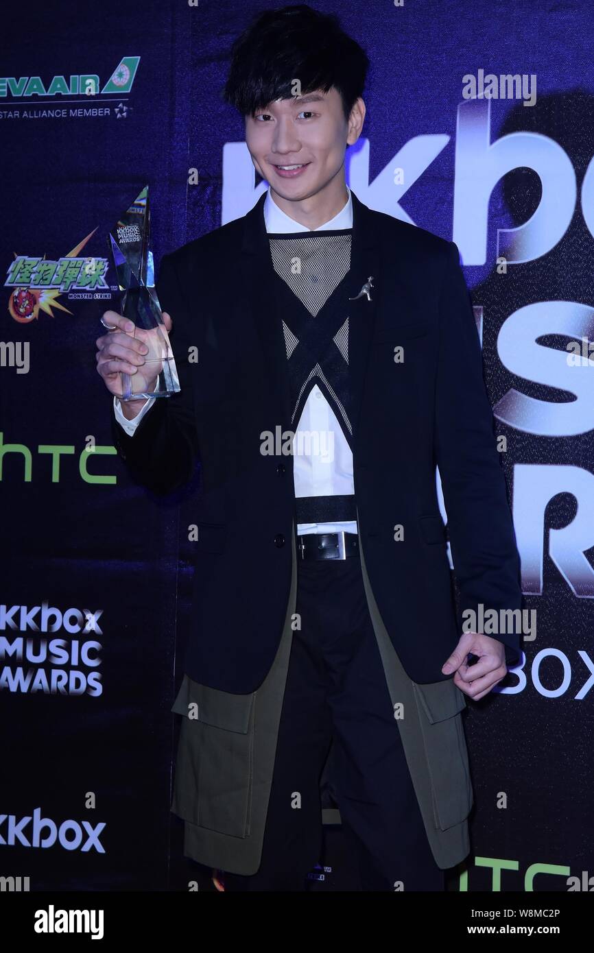 Singaporean singer JJ Lin poses with his trophy at the KKBox Music ...
