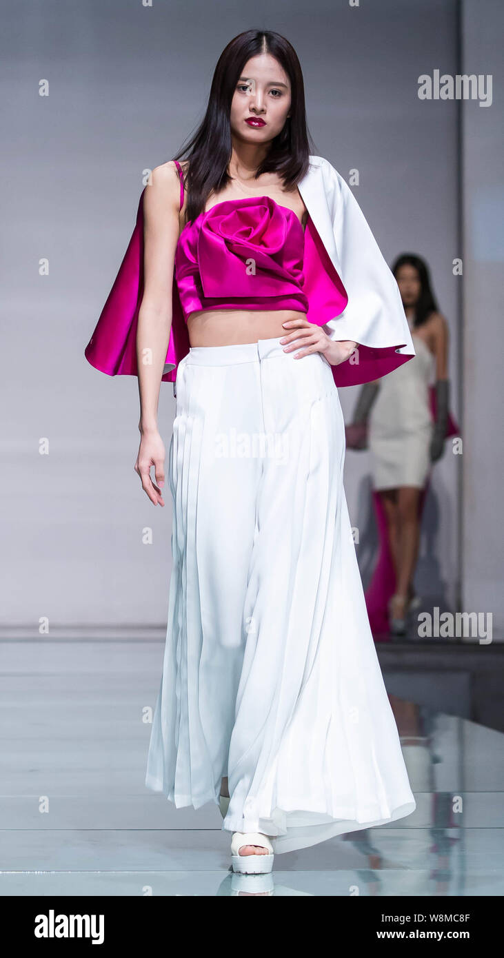 A model displays a creation designed by a student from School of ...