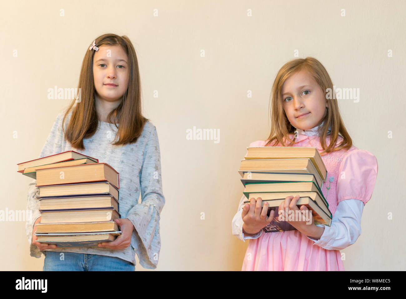 Children with books in their hands Stock Photo - Alamy
