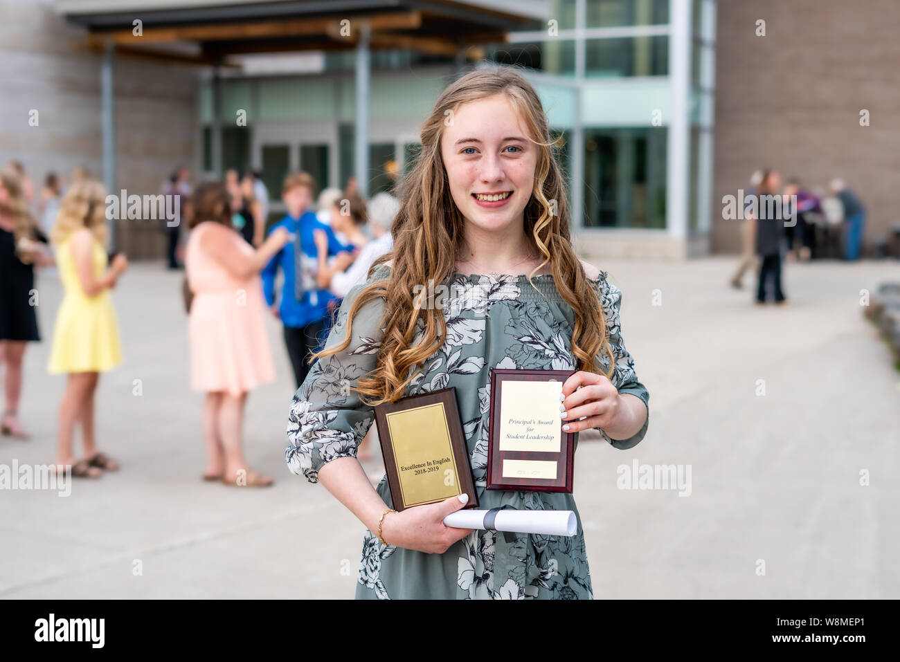 Young Teen Girl/Middle School student standing in front of school with ...