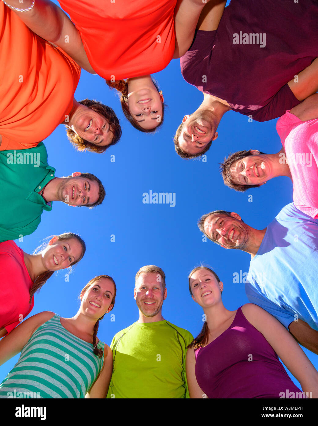 A group in a team building exercise - cohesion in the group brings ...