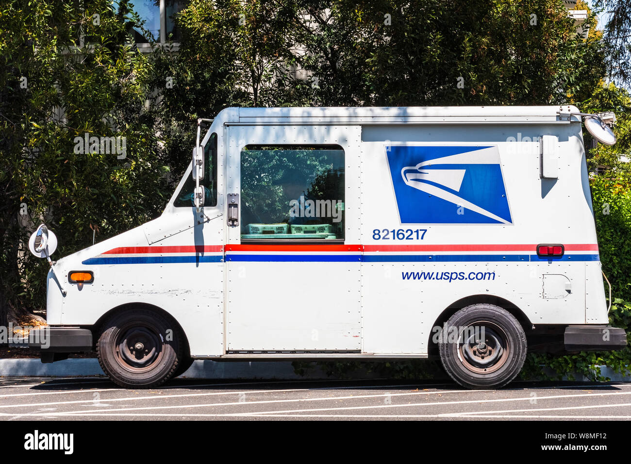 August 8, 2019 Palo Alto / CA / USA - USPS vehicle parked on the side ...