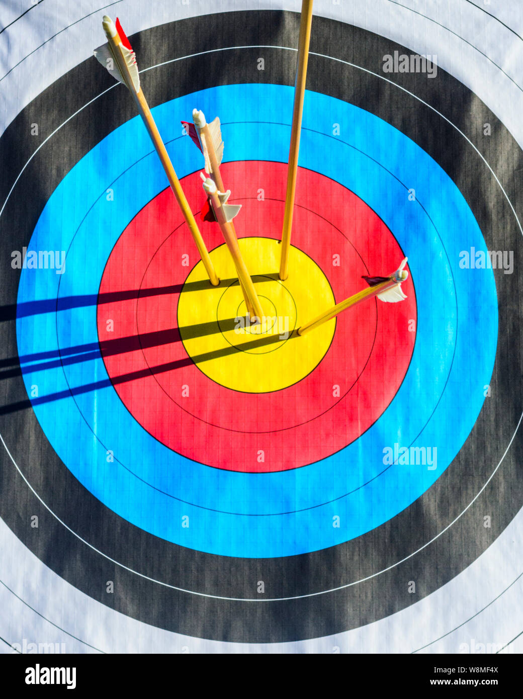Many arrows in target Stock Photo - Alamy