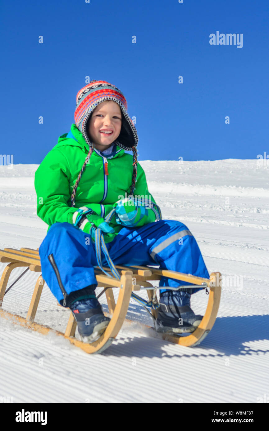 Funny afternoon in wintertime on sleigh slope Stock Photo - Alamy