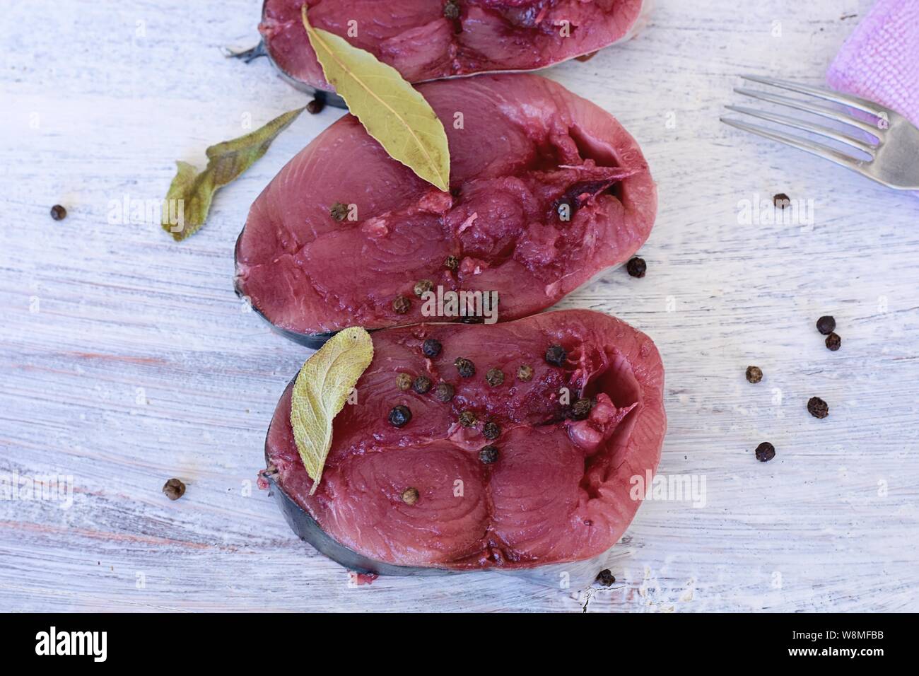 Raw traditional tuna fish-Bonito fish and spices for cooking on a old ...