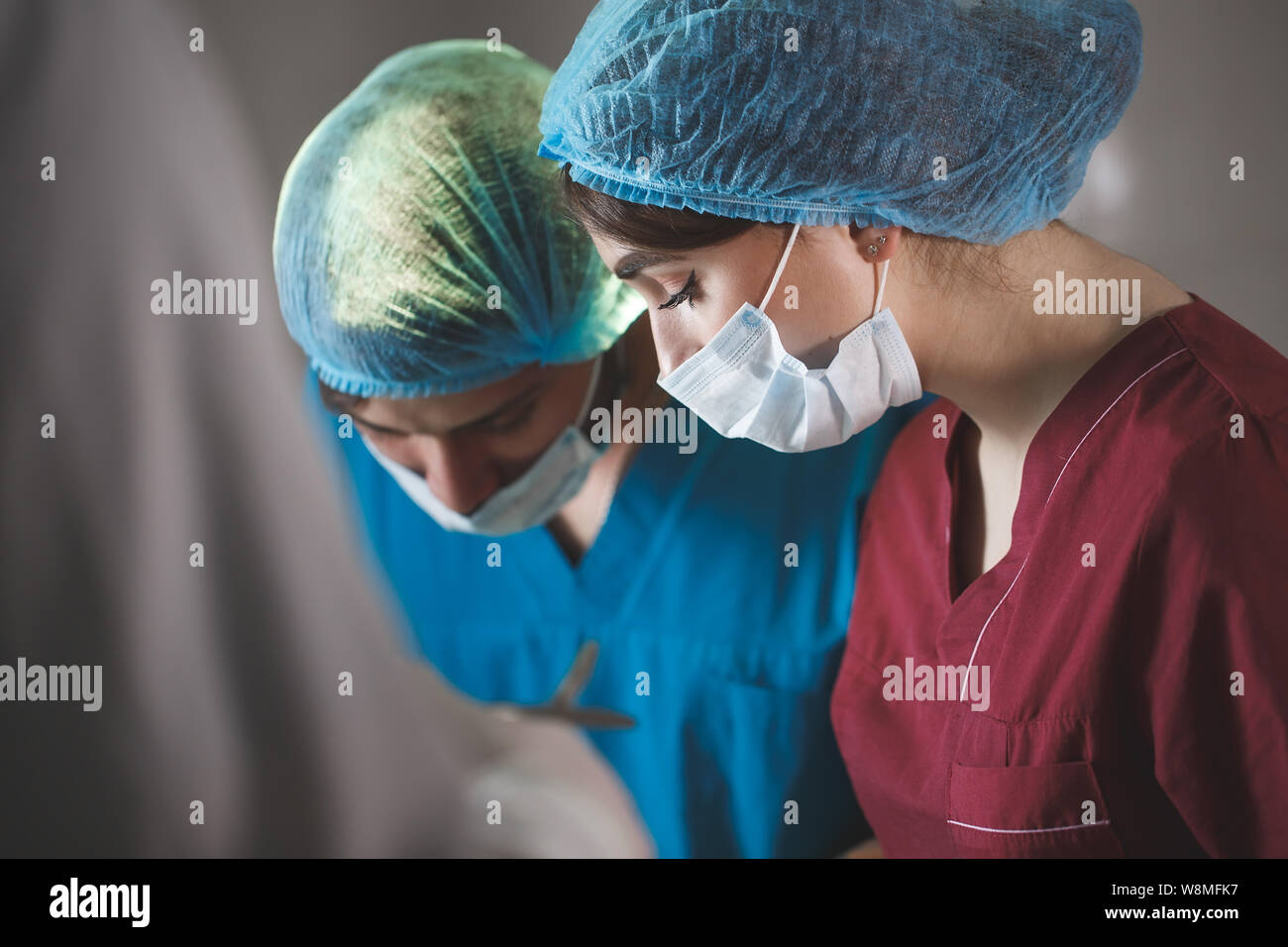 Portrait of surgeons at work, operating in uniform Stock Photo - Alamy