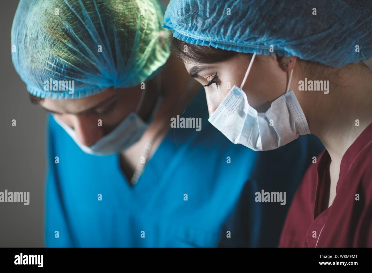 Portrait of surgeons at work, operating in uniform Stock Photo - Alamy
