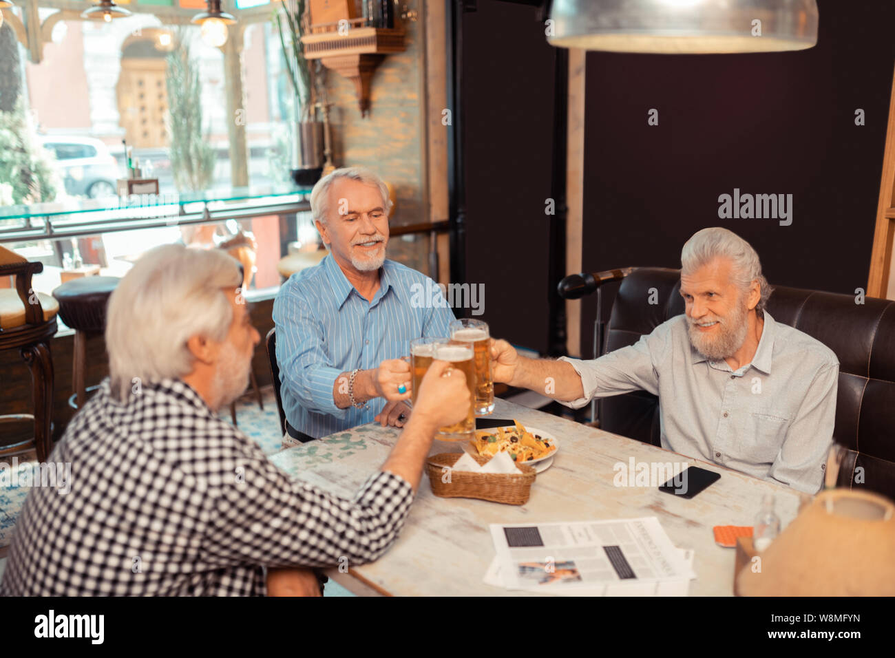 Retired men celebrating the day of friendship Stock Photo - Alamy