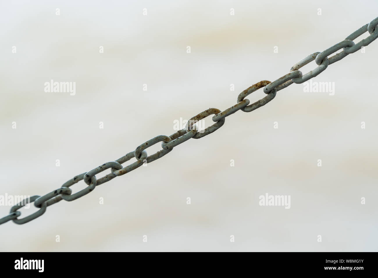 A rusty old chain on white background Stock Photo - Alamy