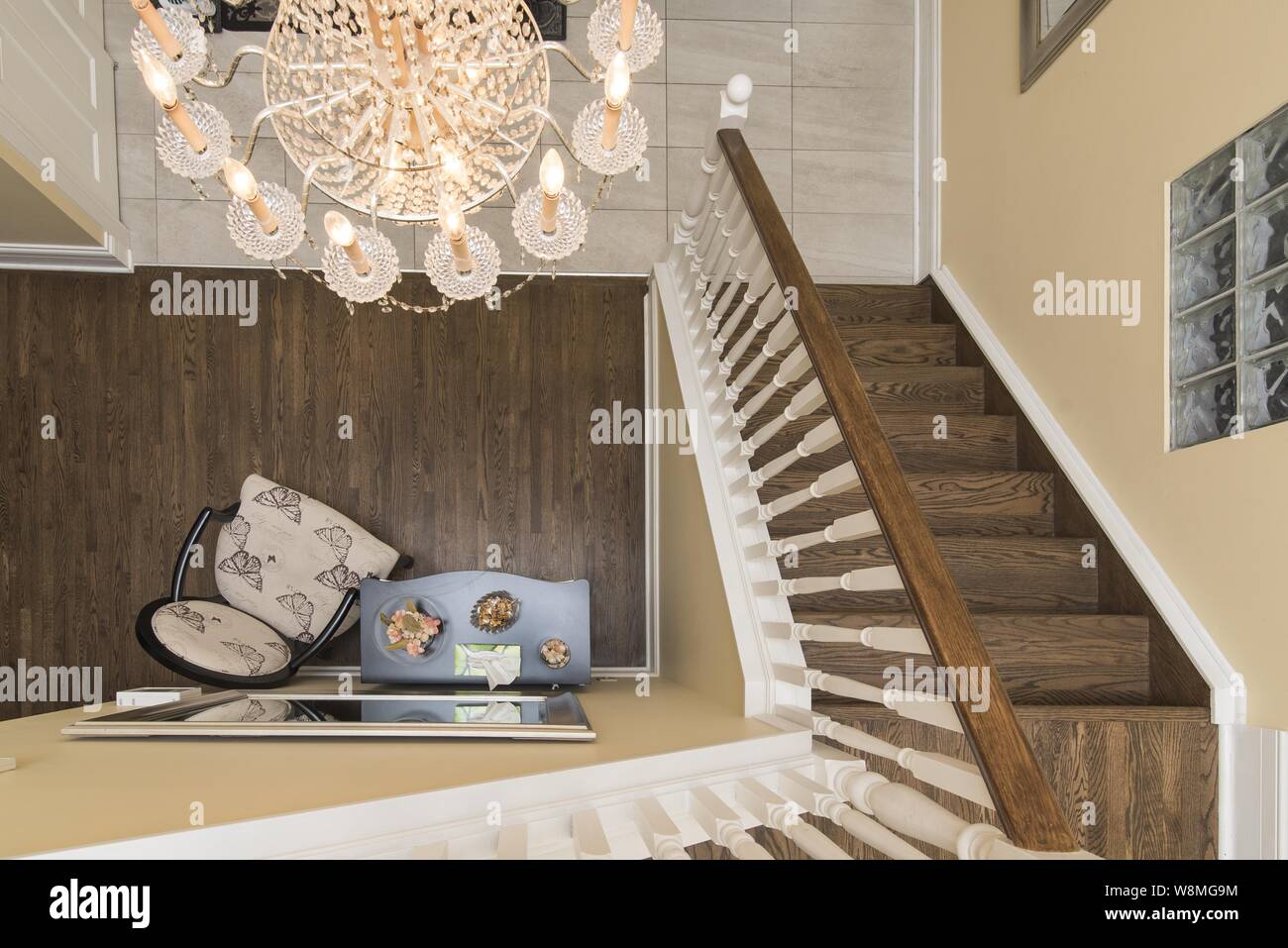 Interior overhead shot of a modern house staircase and a chandelier ...