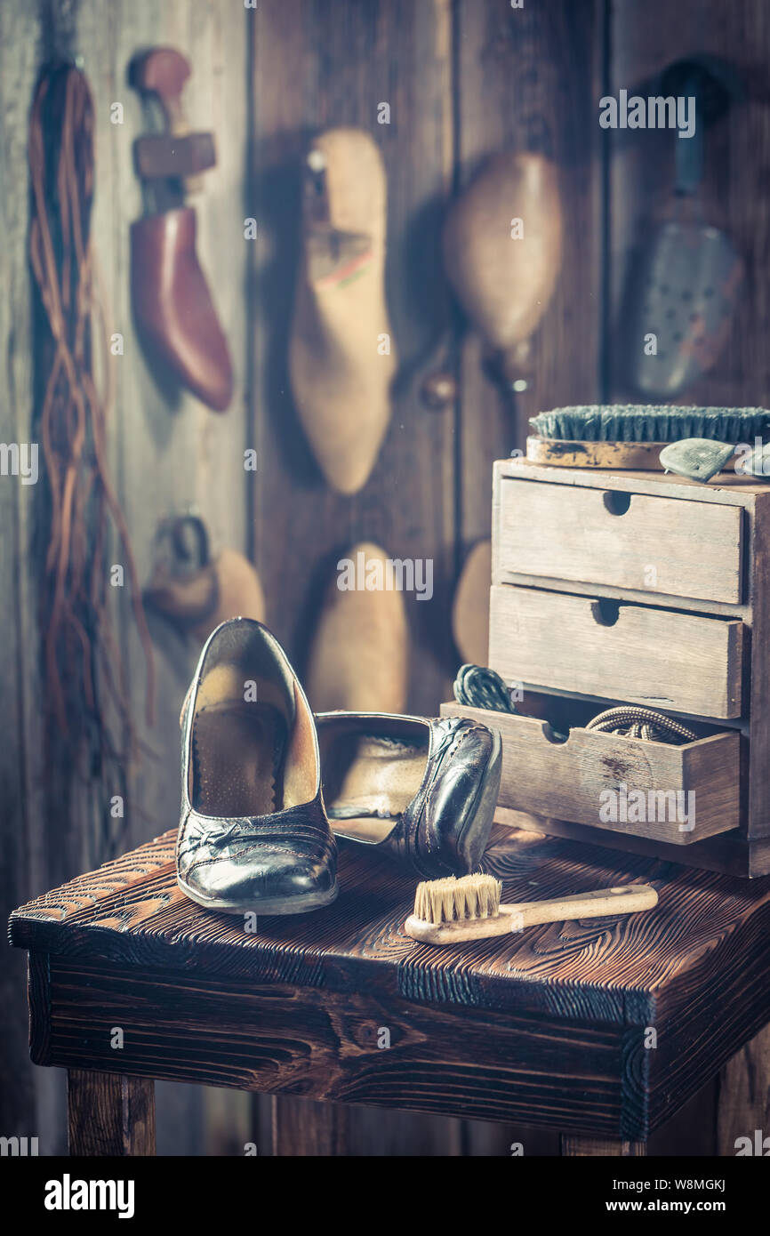 Rustic shoemaker workshop with shoes and brush Stock Photo - Alamy