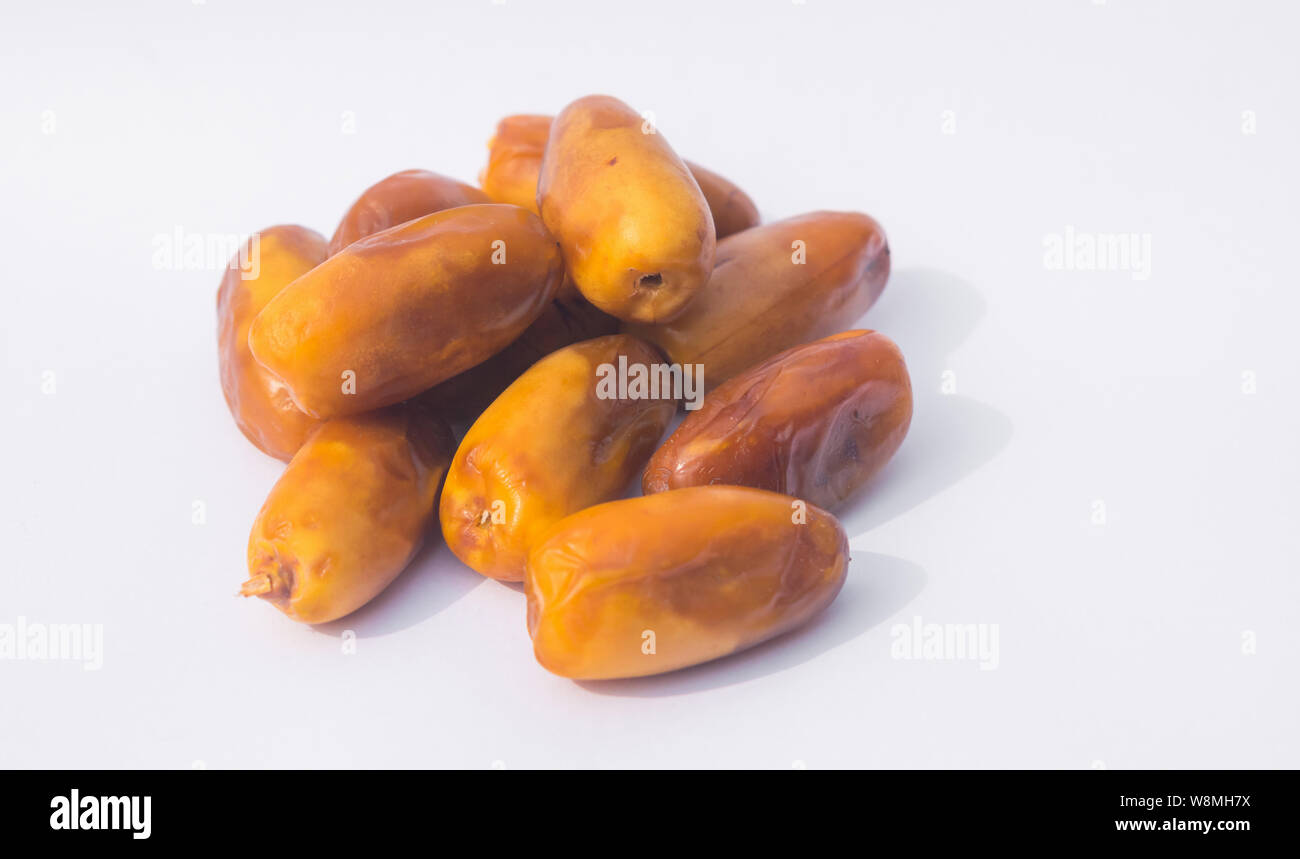 close up of fresh riped delicious yellow dates isolated on white ...