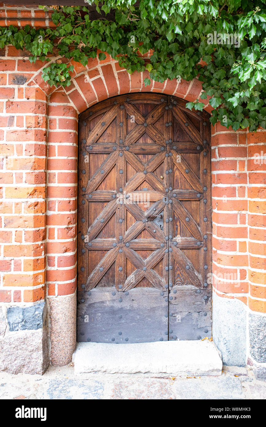 The gothic door in the medieval teutonic knights castle Malbork, Poland ...