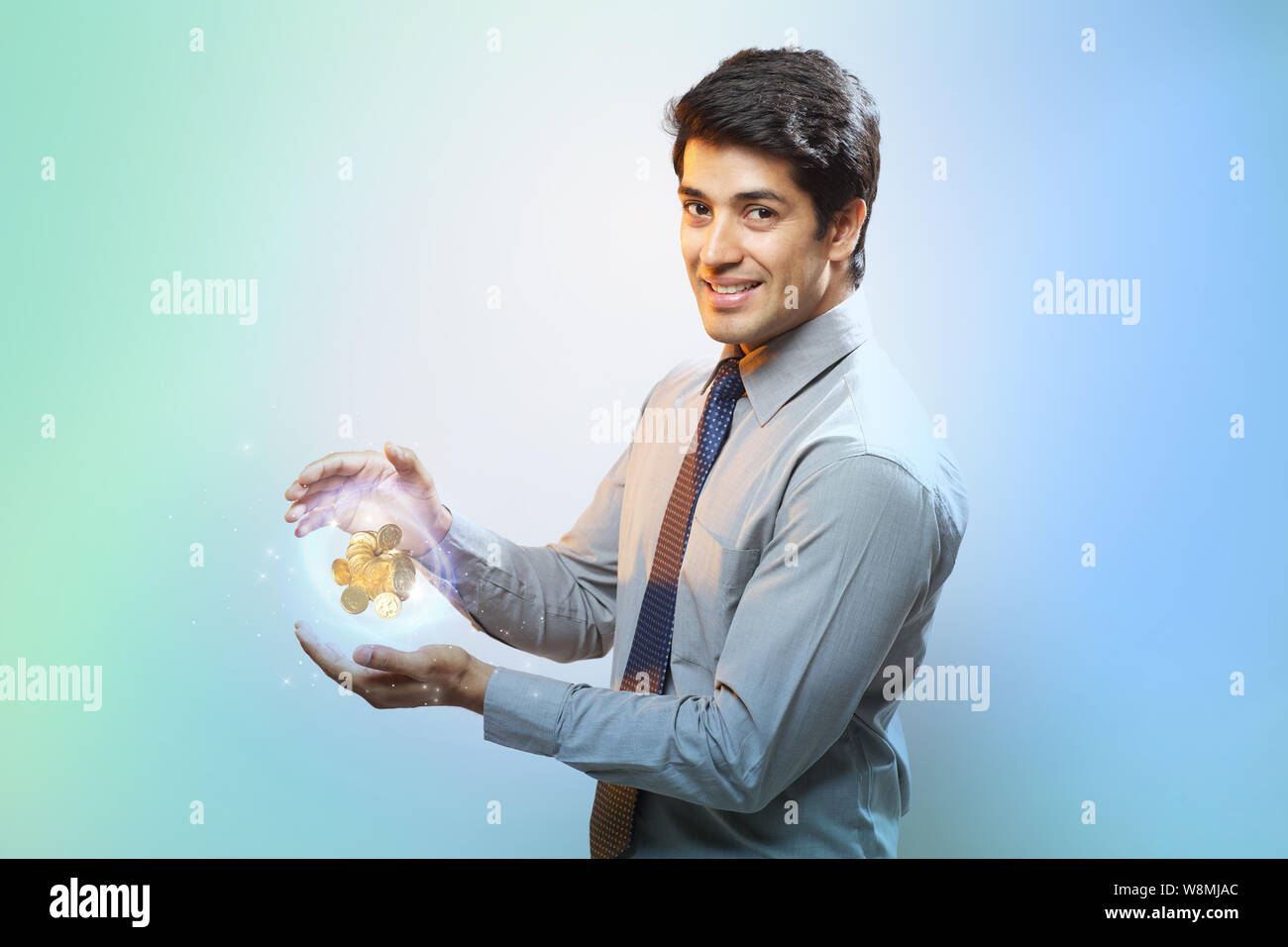 Man standing holding coin hi-res stock photography and images - Alamy