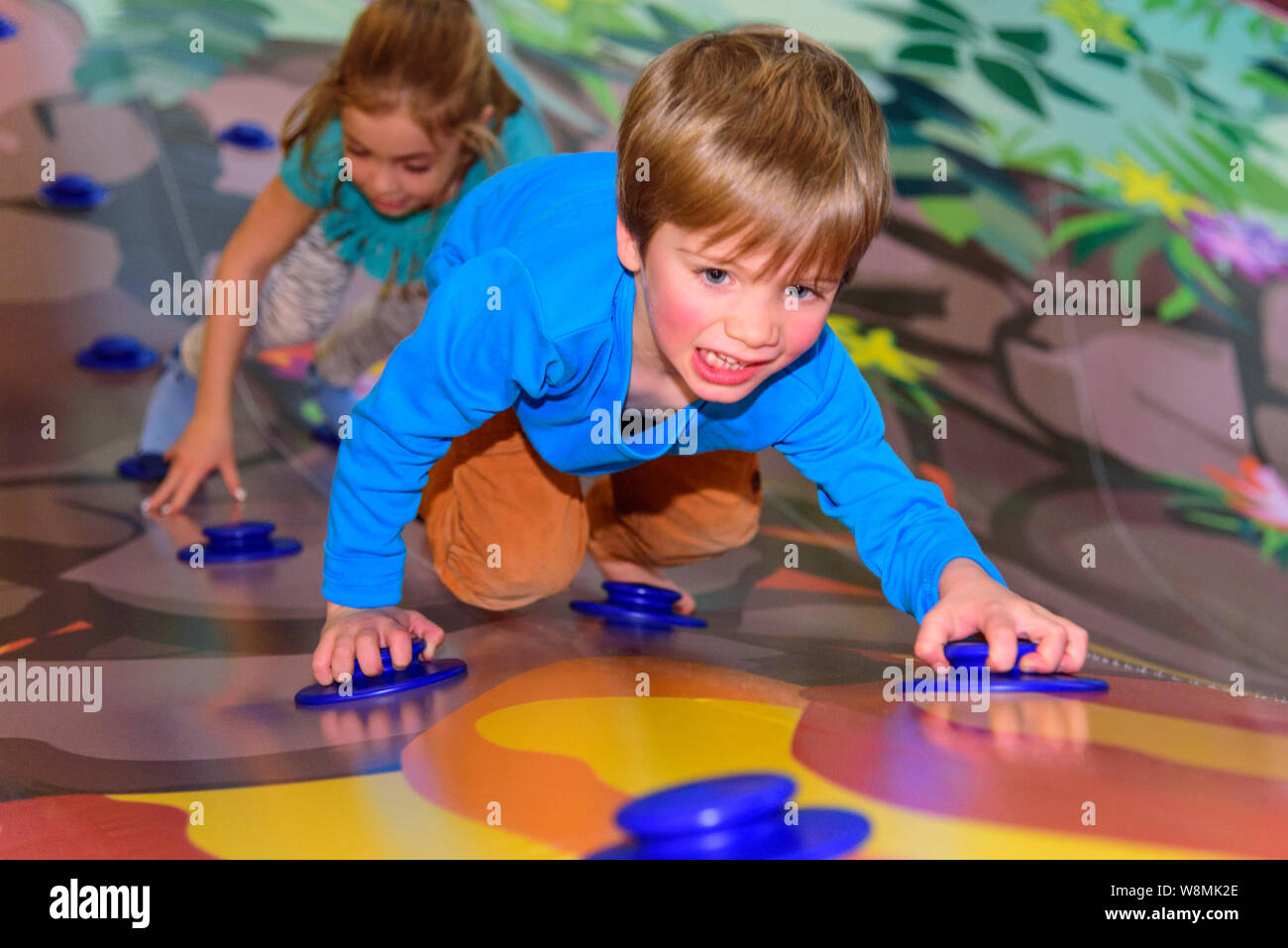 Children at a climbing volcano Stock Photo - Alamy
