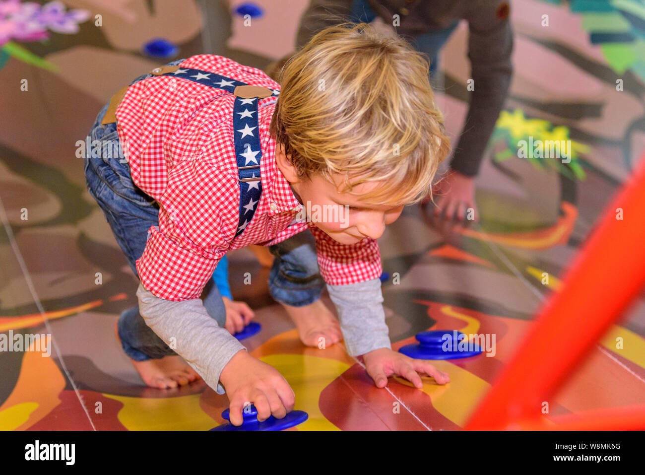 Children at a climbing volcano Stock Photo - Alamy