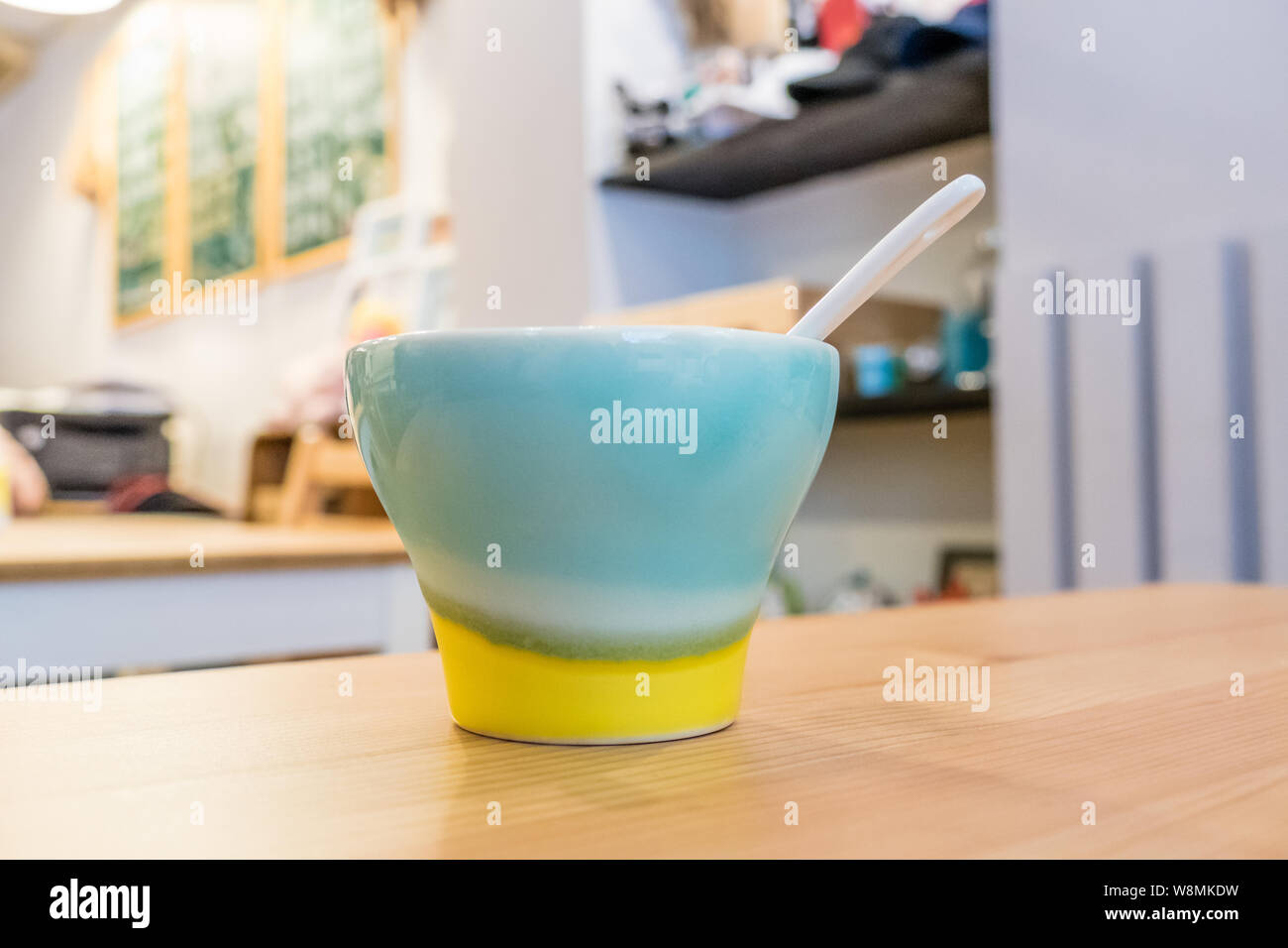 Colorful coffee mug on table Stock Photo - Alamy