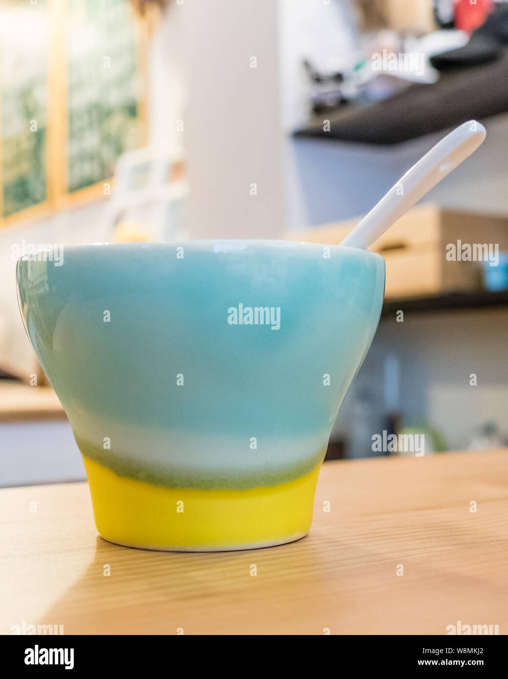 Colorful coffee mug on table Stock Photo - Alamy