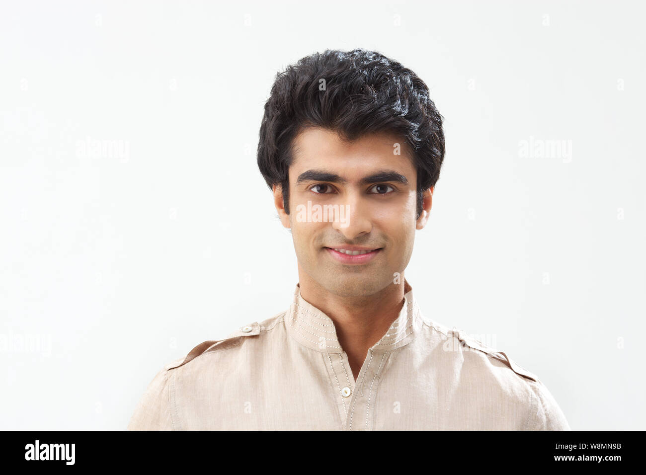 Portrait of a young man smiling Stock Photo - Alamy