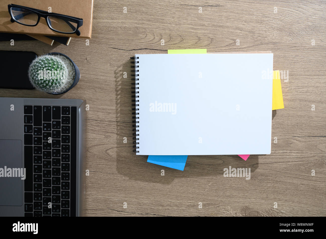 table view with a laptop Office desk header Stock Photo - Alamy