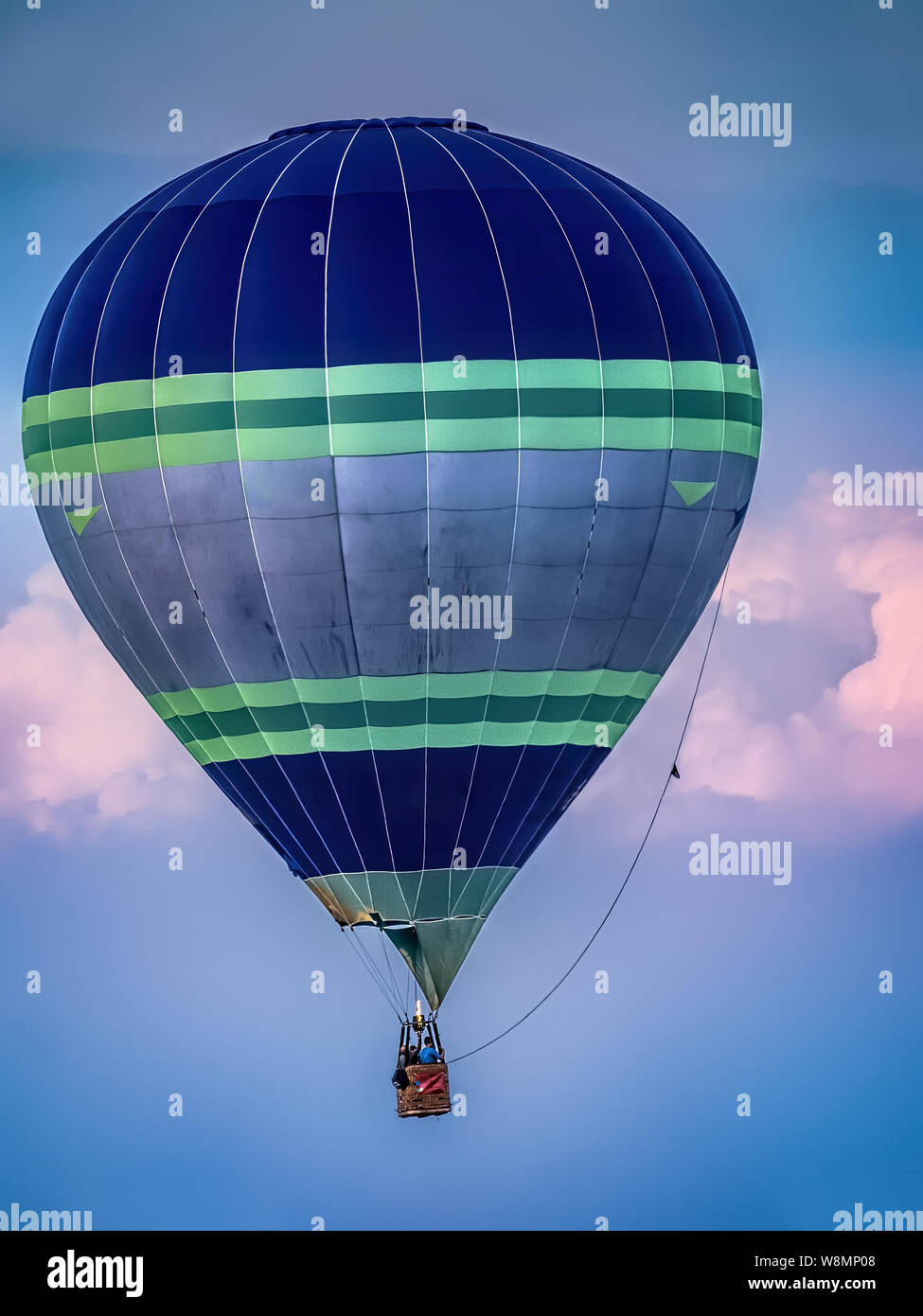 Hot air balloon rising high in the air Stock Photo - Alamy