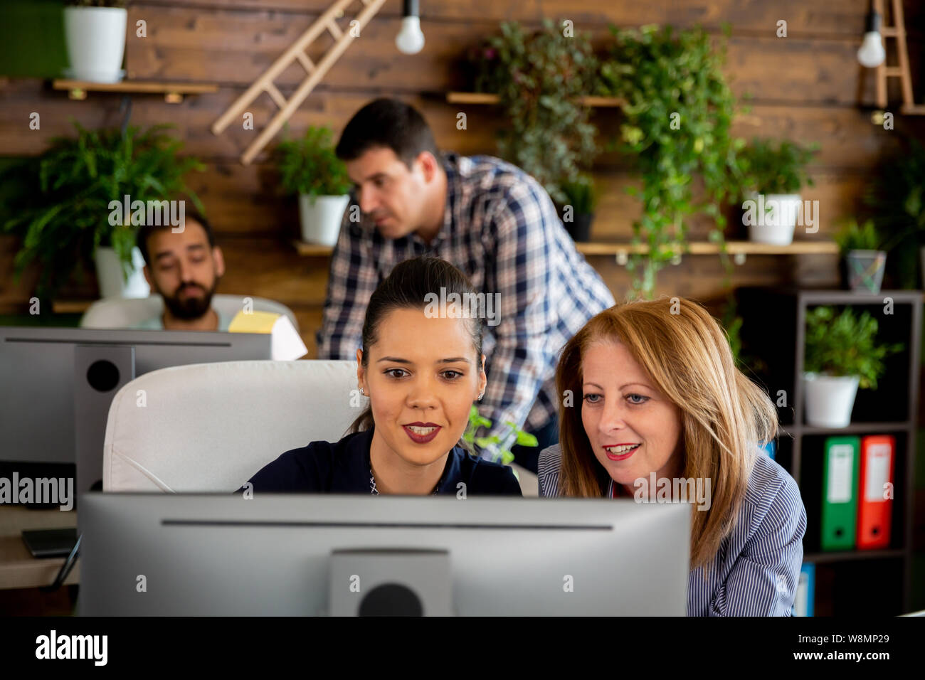 Modern company office with people working at their desks. Employee and ...