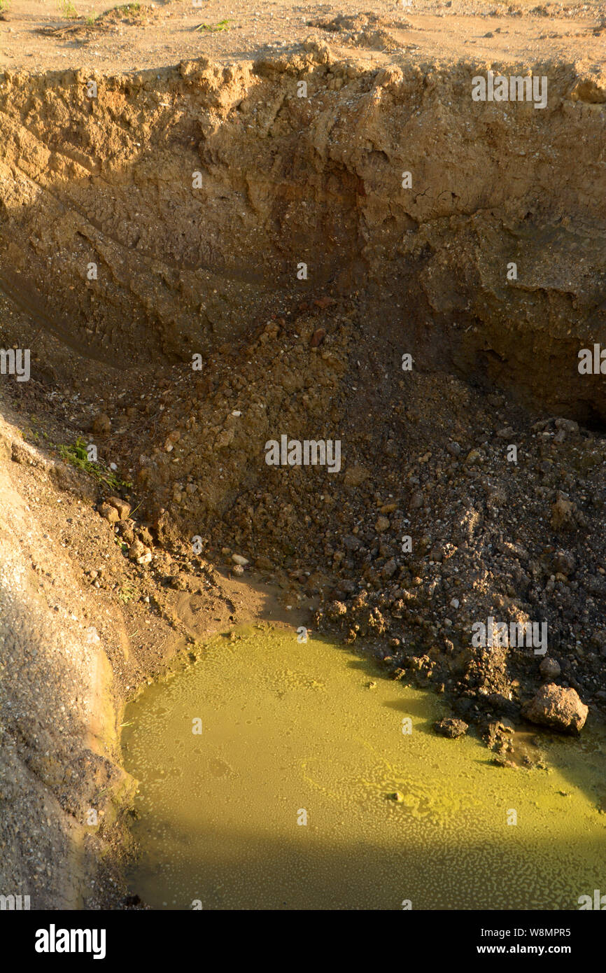 dirty groundwater on excavation, new excavated excavation pit with ...