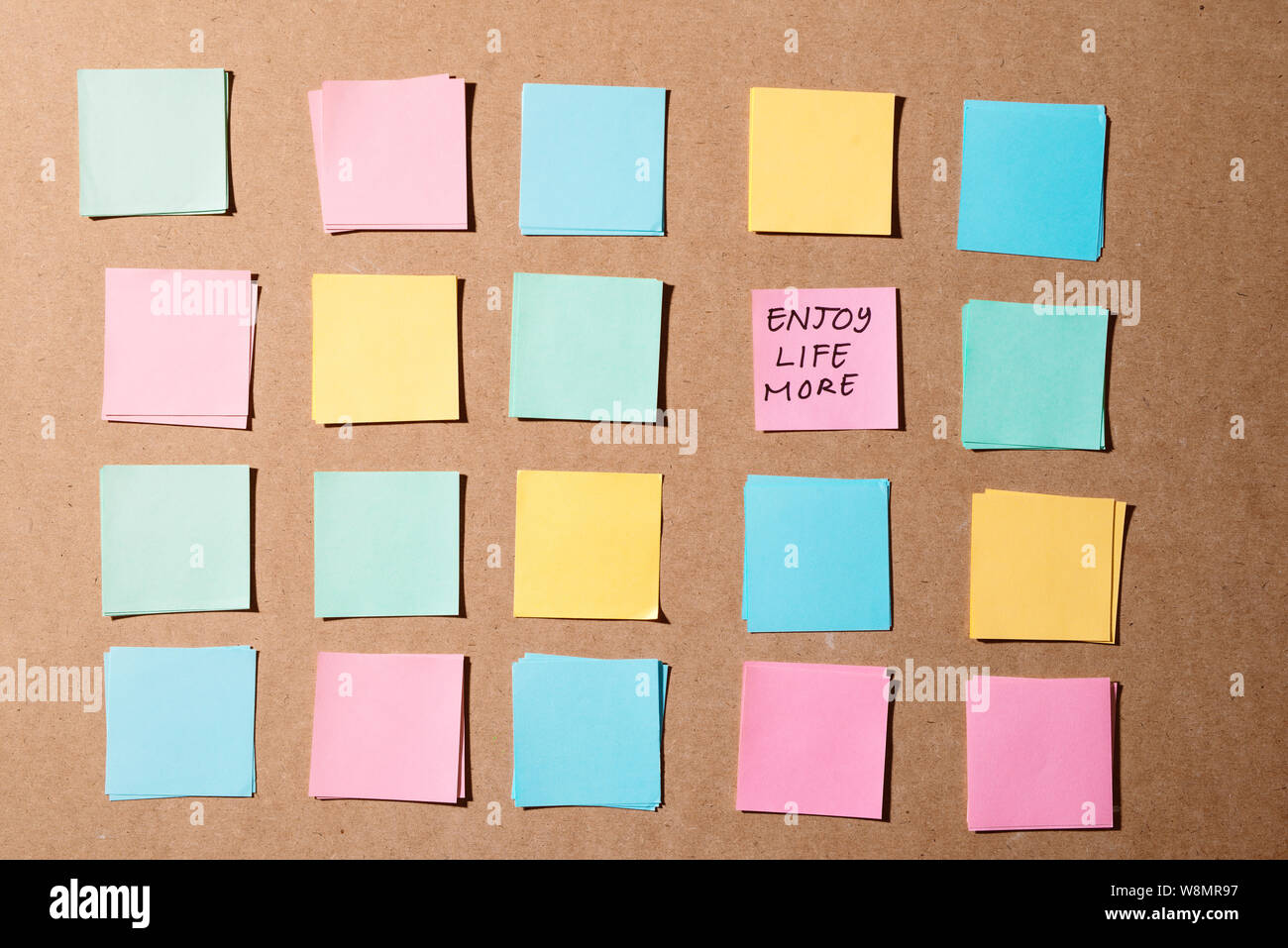 Sticks note paper with text - Enjoy life happy on wood background for ...