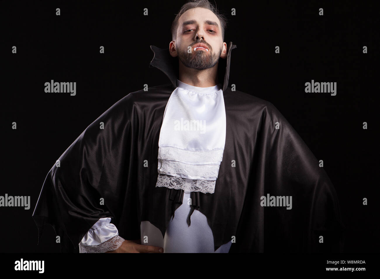 Scary man in dracula costume for halloween looking confident into the ...