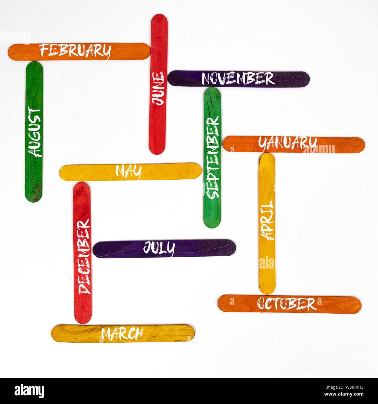 the months of the year written on colored wooden pallets Stock Photo ...