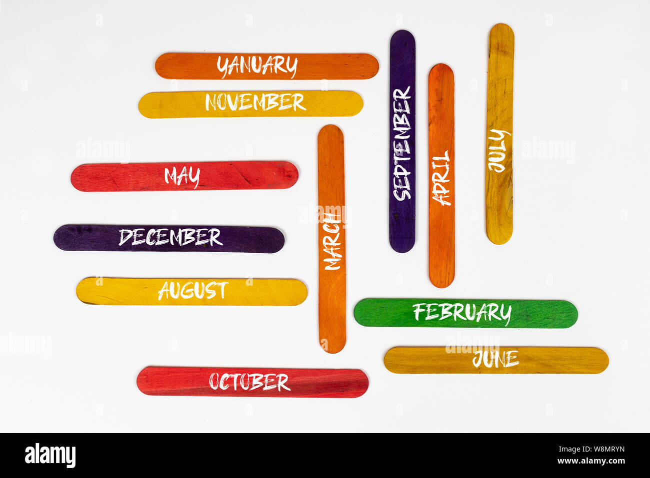 the months of the year written on colored wooden pallets Stock Photo ...