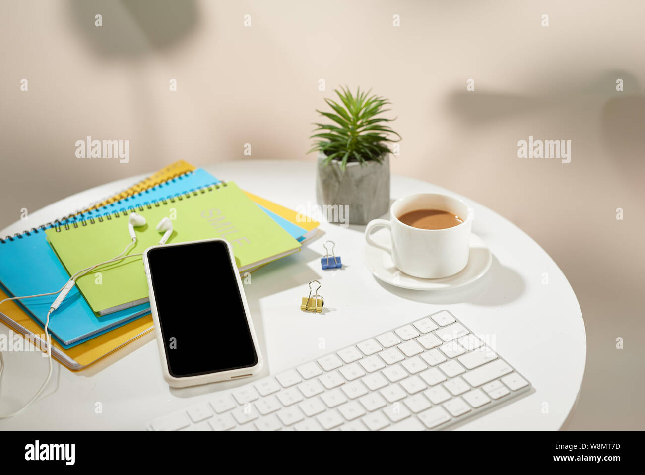 Top view office table desk.Workspace with mobile phone and office ...