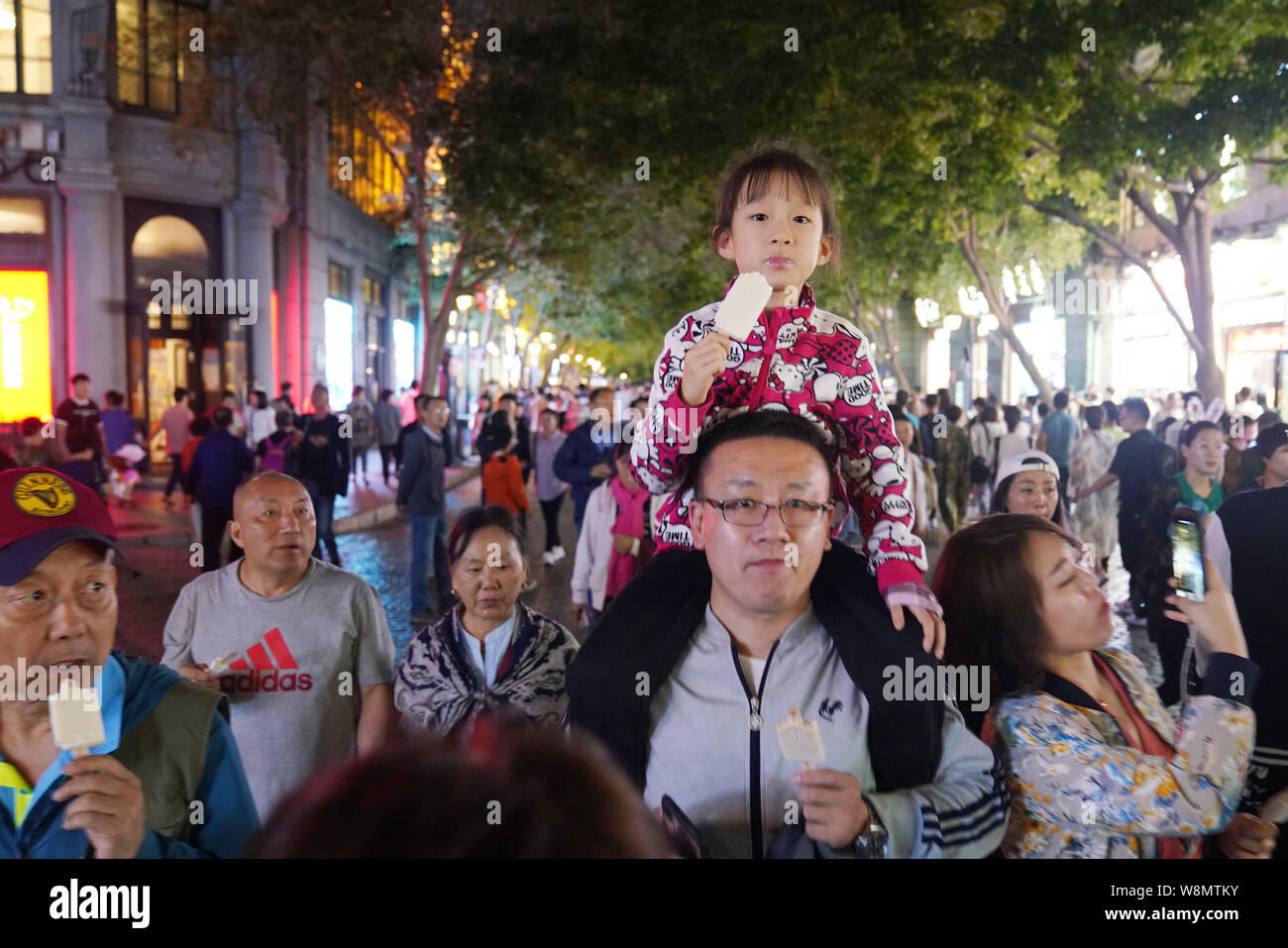 Harbin, China's Heilongjiang Province. 9th Aug, 2019. People walk on ...