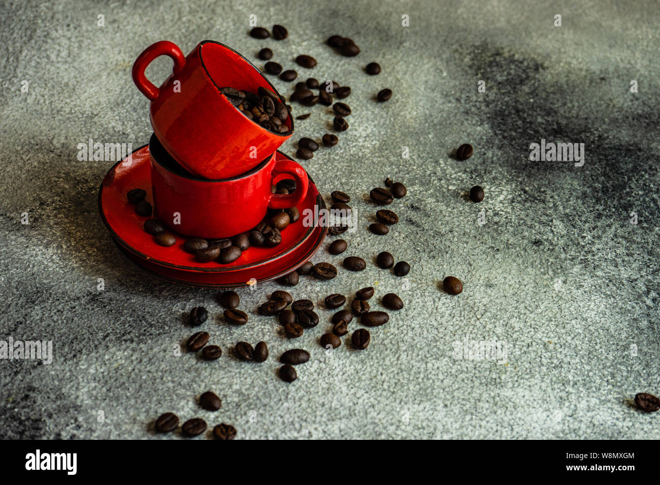 Ceramic cup and coffee beans on stone background with copy space as a ...