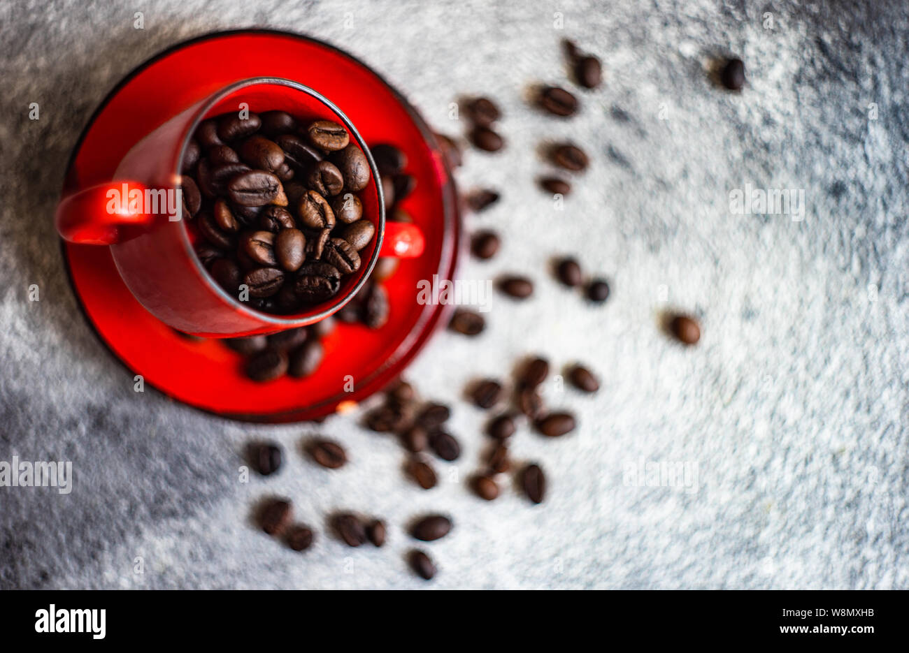 Ceramic cup and coffee beans on stone background with copy space as a ...