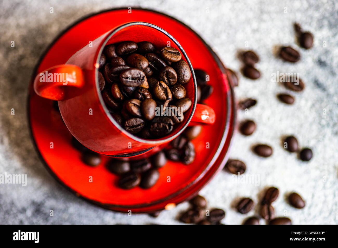 Ceramic cup and coffee beans on stone background with copy space as a ...