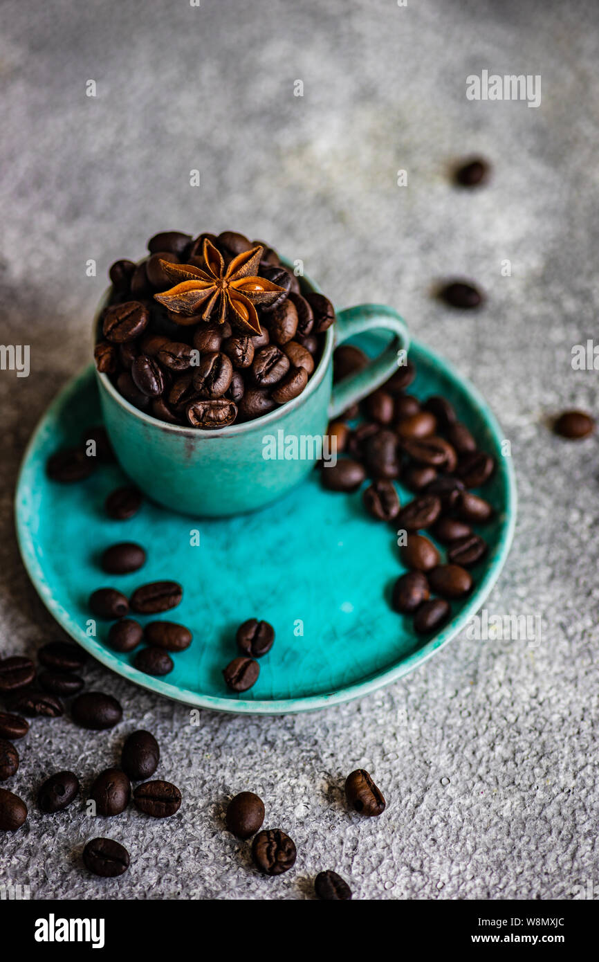 Ceramic cup and coffee beans on stone background with copy space as a ...