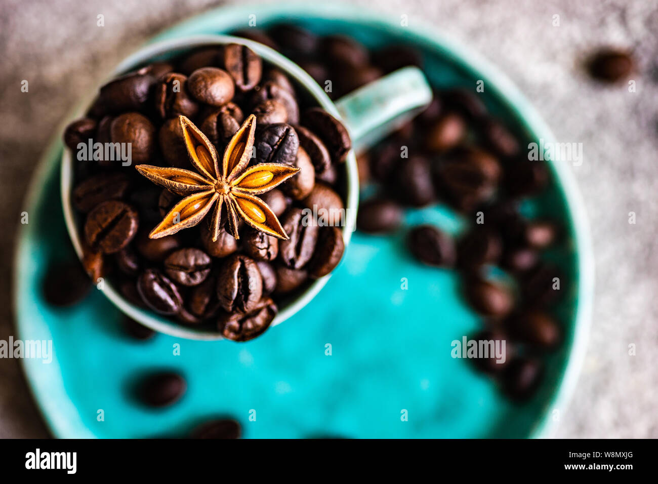 Ceramic cup and coffee beans on stone background with copy space as a ...