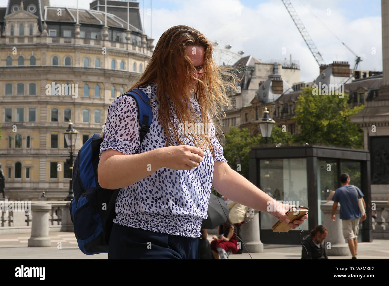 London, UK. 10th Aug, 2019. A woman's hair covers her face on a windy ...