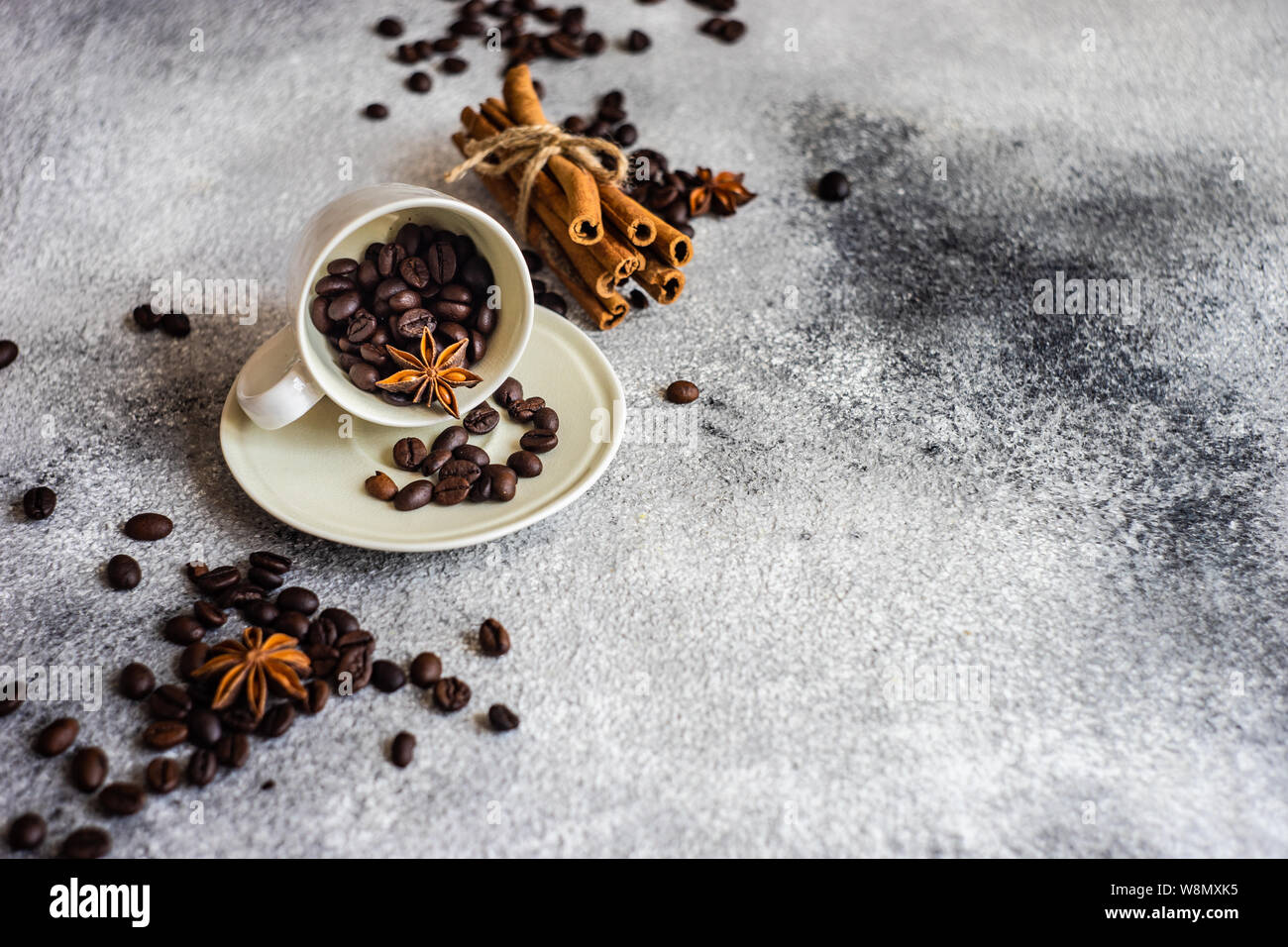 Ceramic cup and coffee beans on stone background with copy space as a ...