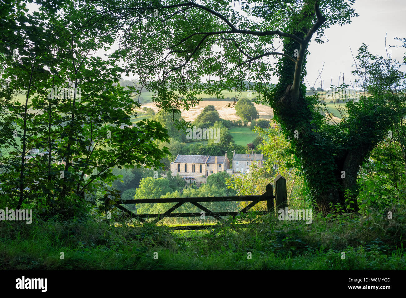 Gate in front of Naunton village in summer, Naunton, Cotswolds ...