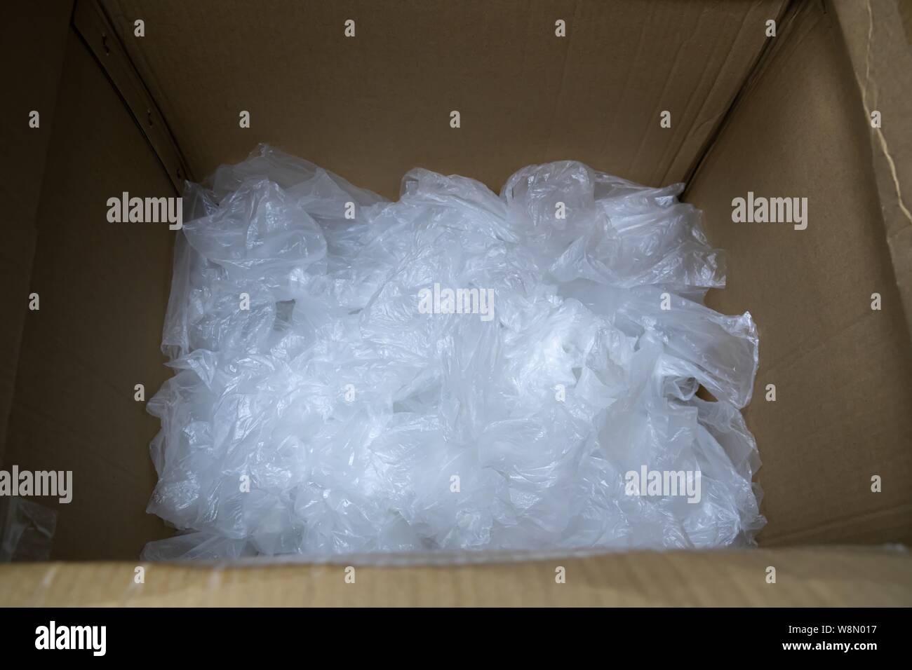 used plastic bag in paper box for recycling Stock Photo - Alamy