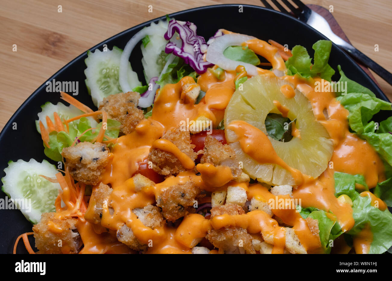Salad and cheese dressing on table Stock Photo - Alamy