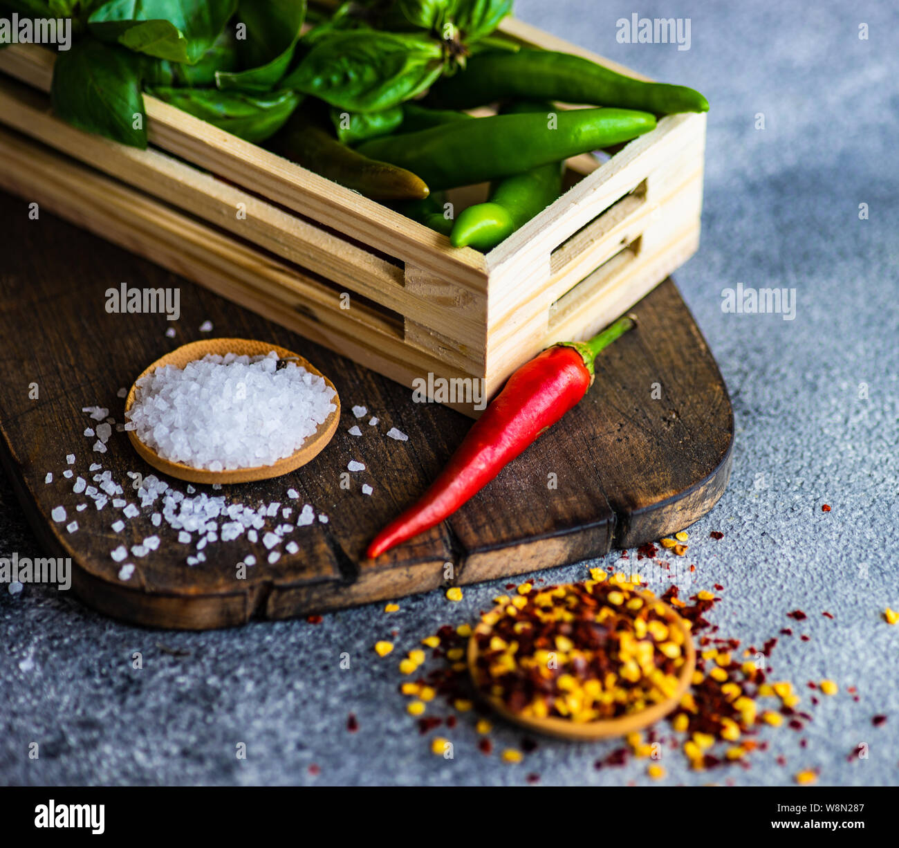 Cooking concept with hot chilli pepper on stone background with copy ...