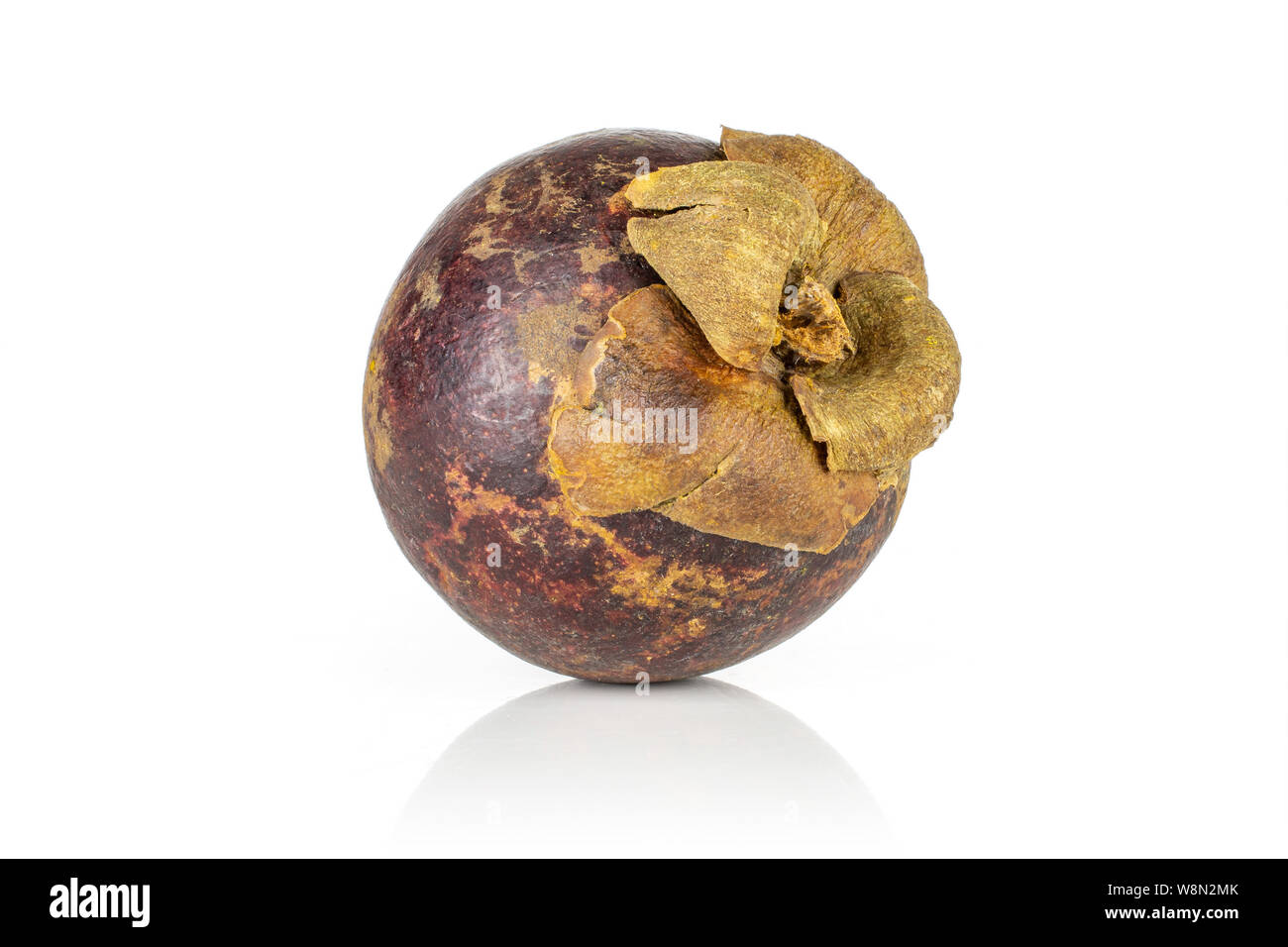 One whole exotic deep purple mangosteen isolated on white background ...