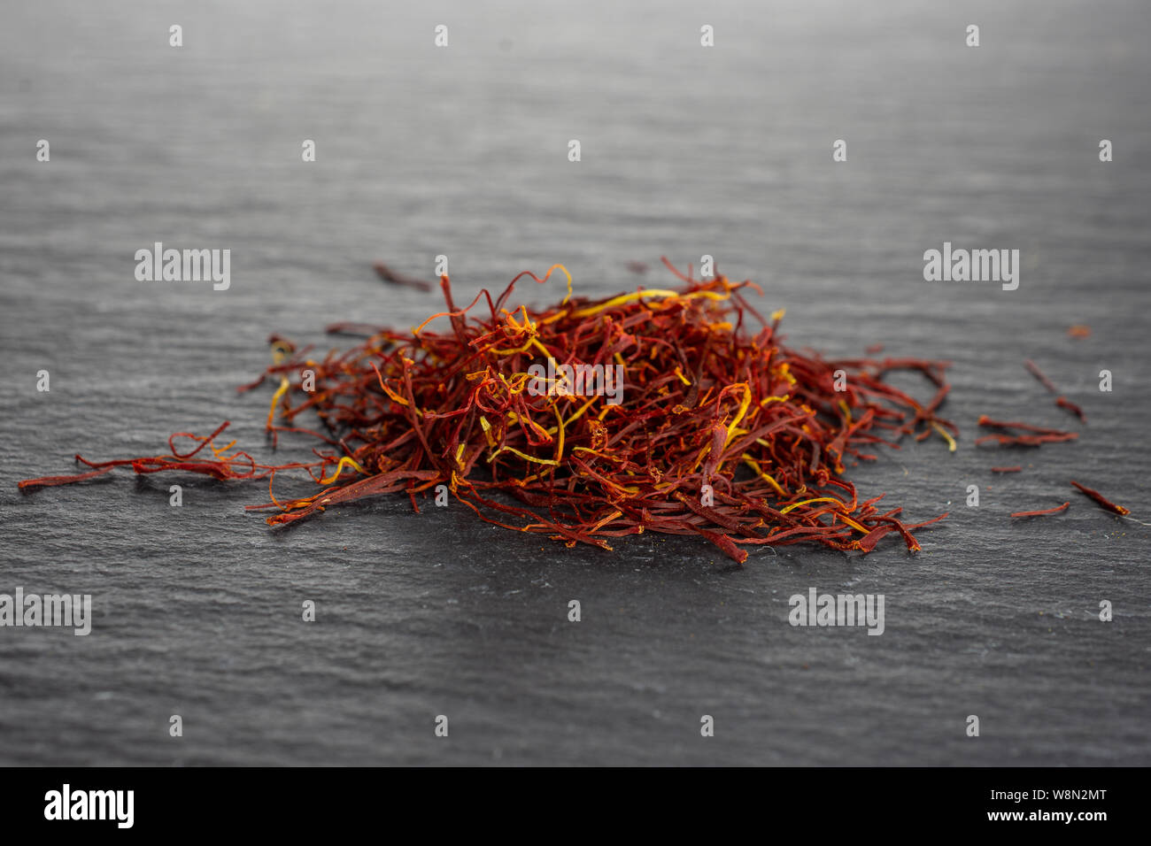Lot of whole dry shaffron thread heap on grey stone Stock Photo - Alamy