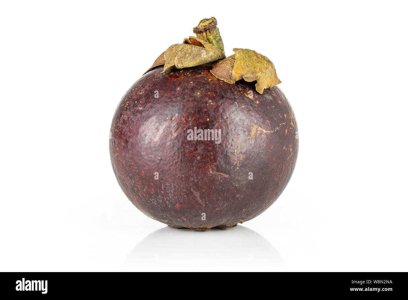 One whole deep purple mangosteen isolated on white background Stock ...