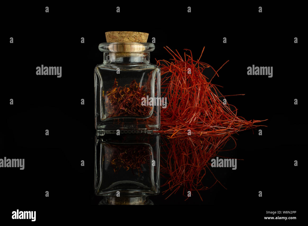 Lot of whole dry shaffron thread with needles heap in glass bottle with ...