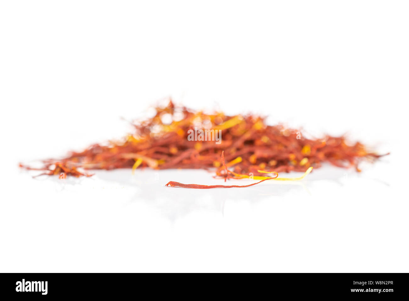 Lot of whole dry shaffron thread one in focus isolated on white ...